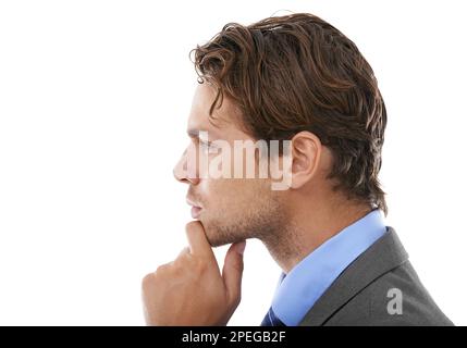Wondering what the future holds. A pensive businessman against a white ...