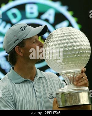 South Africa's Retief Goosen kisses his wife Tracy after his victory at ...