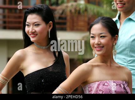 Miss Singapore Shu Jun Lisa Huang, center, parades in a swimsuit during ...