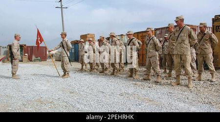 A member of B Company, First Engineer Battalion assists in the ...
