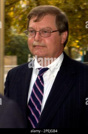 Former Merrill Lynch & Co. executive Daniel Bayly, right, leaves the ...
