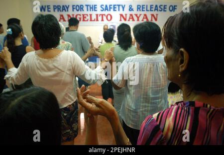 Friends and relatives of Angelito Nayan, the Filipino diplomat recently ...