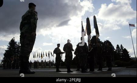 Lt. General James P. Dubik, center, stands at attention as he assumes ...