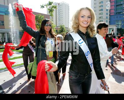 Miss U.S.A. Amy Holbrook, right, and Miss Egypt Dina Adel dance with a ...