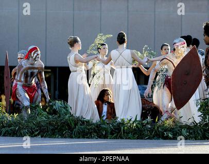 Australia's Olympic champion Cathy Freeman, center, sits as Aboriginal ...