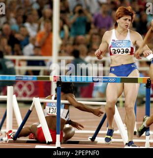 Canada's Perdita Felicien lays on the track after tripping over a ...