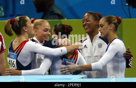 Courtney McCool of the United States, right, hugs teammate Mohini ...