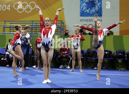 Courtney McCool of the United States, right, hugs teammate Mohini ...