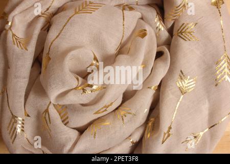 Pile of Cream Colored and Gold Chiffon Fabric overhead view Stock Photo ...