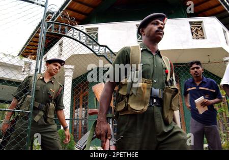 Sri Lankan army soldiers guard along a street in Colombo, Sri Lanka, on ...