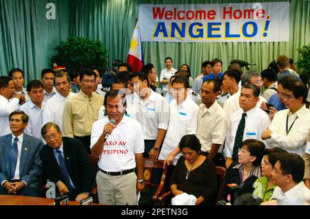 Released Filipino hostage Angelo Dela Cruz is hugged by his daughter ...