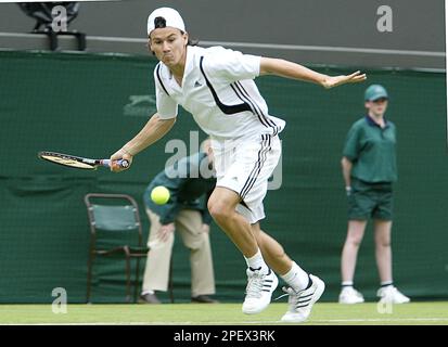 Wesley Moodie of South Africa reaches for a volley to opponent Fabrice ...