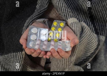 Hands with a blisters of medicine pills Stock Photo - Alamy