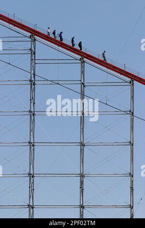 Roller coaster climbing hill Stock Photo - Alamy