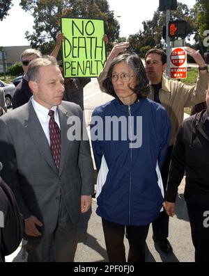 San Francisco Police Chief Heather Fong walks to a news conference past ...