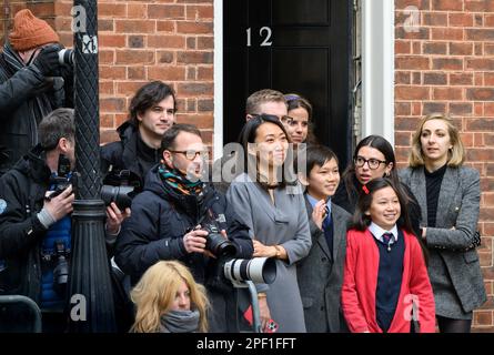 Jeremy Hunt's family look on as he and the treasury team pose for ...