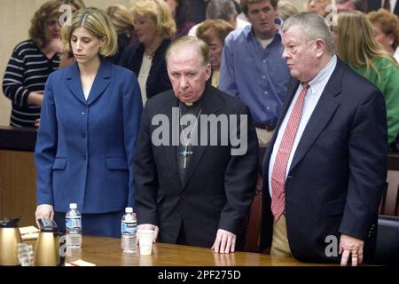 Bishop Thomas O'Brien's defense attorney Tom Henze,left, gives his ...