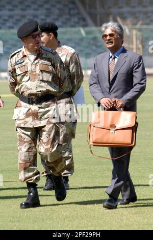Senior Indian police officer Yashovardhan Azad, right, shakes hand with ...