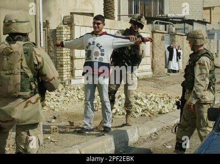 US Army Sgt. John Rhodes (left) of Charlie Company 1-6 Infantry 1st ...