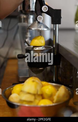 Lemon squeezer machine in cafe squeezes fresh lemons for juice Stock ...