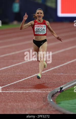 Luiza GEGA celebrating as she crosses the finish line to win the 3000m ...