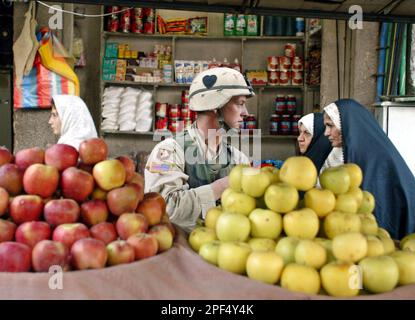 U.S. Army Spc Daniel Costner of the 101st Airborne Division patrols a ...