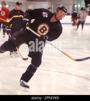 Boston Bruins defenseman Hal Gill (25) checks Atlanta Thrashers center ...