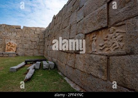 Massive stone walls which form the fortification of Hampi which was the ...