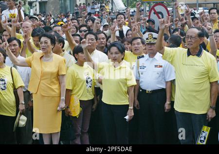 People flash the "L" sign (for Laban, meaning Fight!) as they sing a ...