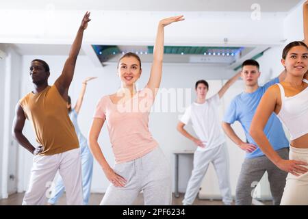 Women and man learning swing steps at modern dance class Stock Photo ...