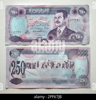 The front of the Iraq 25 Dinars note featuring Saddam Hussein Stock ...