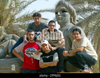 The boys from the British band 'One Direction' get mobbed as they leave ...