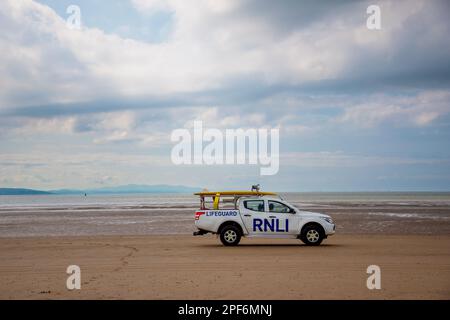 RNLI Lifeguard Mitsubishi 4x4 pick up truck on Crosby Beach, Merseyside ...