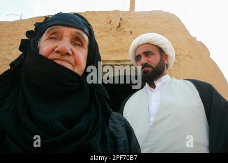 73-year-old Safiya Ahmed Hussain stands near her former home in Dujail ...