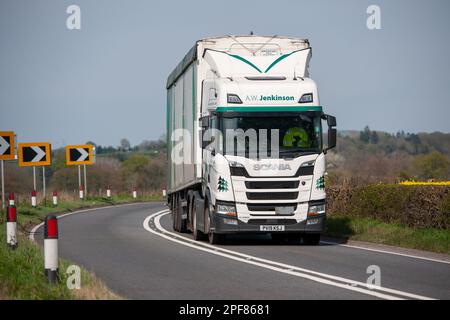 A. W. Jenkinson forest and timber products truck rounding a corner on a ...