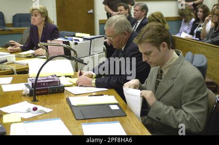 Christian Longo, right, sits with with defense attorney, Ken Hadley, at ...