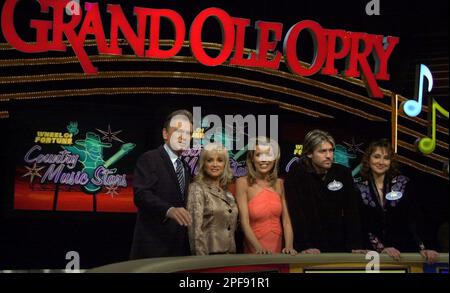 WHEEL OF FORTUNE, (from left): co-host Susan Stafford, host Chuck ...