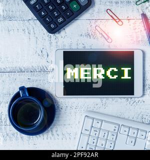 Sign displaying Merci. Word Written on what is said or response when ...