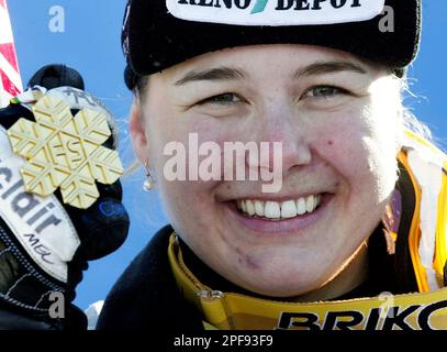 Canadian Melanie Turgeon displays the gold medal she won in the women's ...