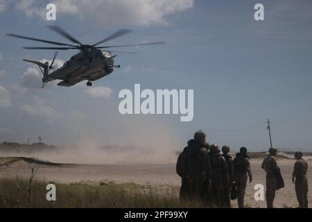 Marines and Sailors with 1st Marine Raider Battalion conduct helocast ...