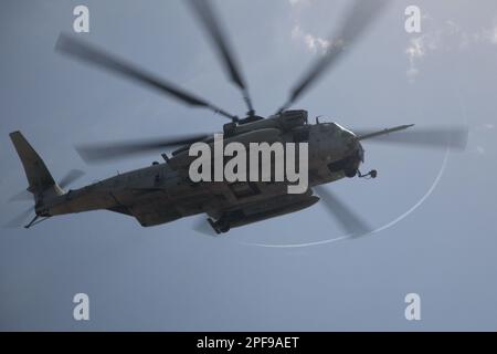 Marines and Sailors with 1st Marine Raider Battalion conduct helocast ...