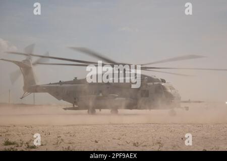 Marines and Sailors with 1st Marine Raider Battalion conduct helocast ...