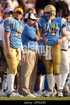 UCLA head coach Bob Toledo, left, shares a laugh with Wisconsin head ...