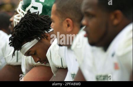 Michigan State's Luc Mullinder, left, and Brandon McKinney, right, sit ...