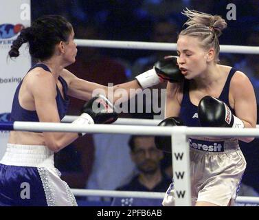German boxer and defending champion Regina Halmich, left, fights with ...