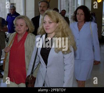 An unidentified mother walks with her daughter on the Island of Love ...