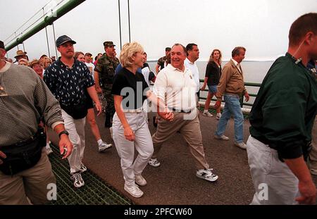 Gov. John Engler and wife Michelle pose with their triplets during a ...
