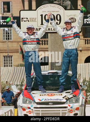 Colin McRae, right, and his co driver Derek Ringer celebrate their ...