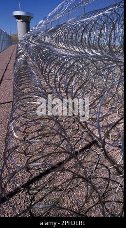Guard towers surround the federal penitentiary facility known as ...