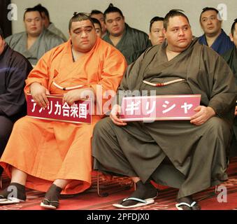 Hawaiian-born Sumo grand champion Musashimaru, center, pounds steamed ...